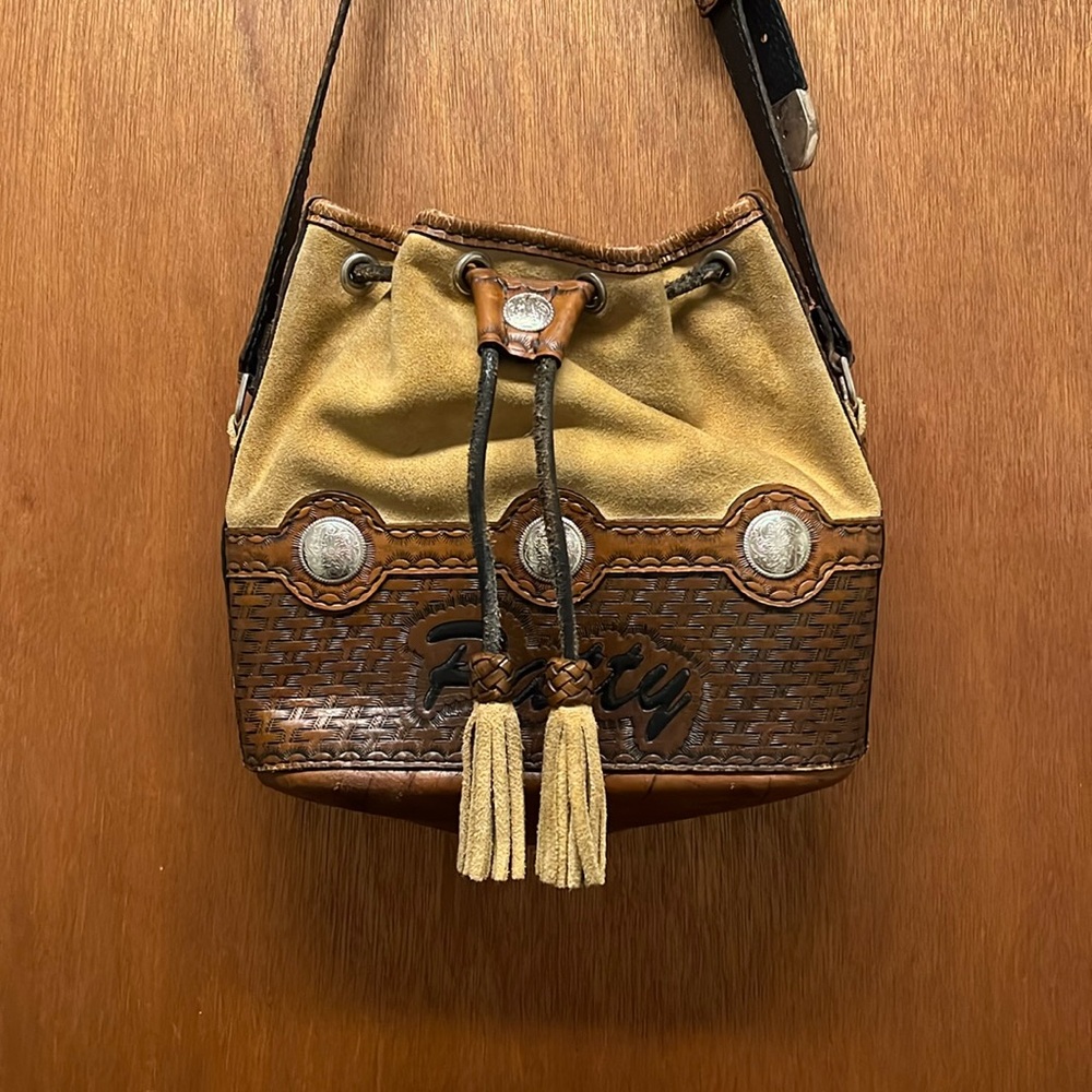 “Patty” 1970s Tooled Leather Bucket Bag With Drawstri… - Gem